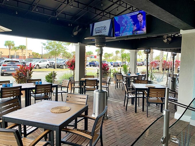 Florida's perfect weather deserves perfect patios, and Agave Azul delivers with this comfortable outdoor seating area surrounded by tropical plants.