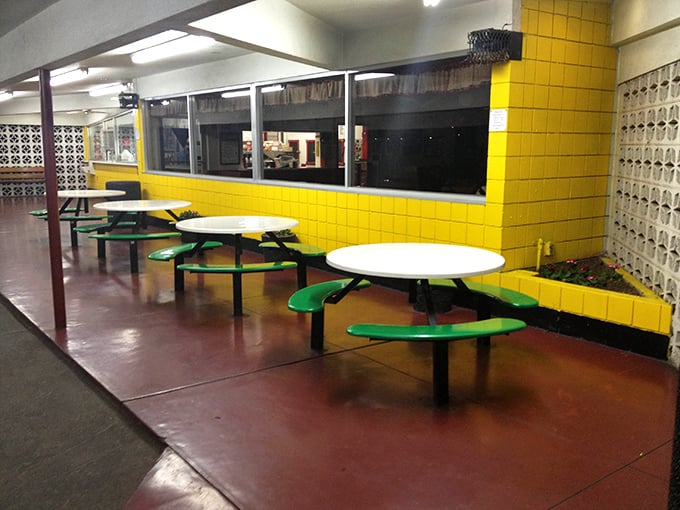 These aren't just tables – they're community gathering spots where strangers become neighbors over shared ketchup bottles.