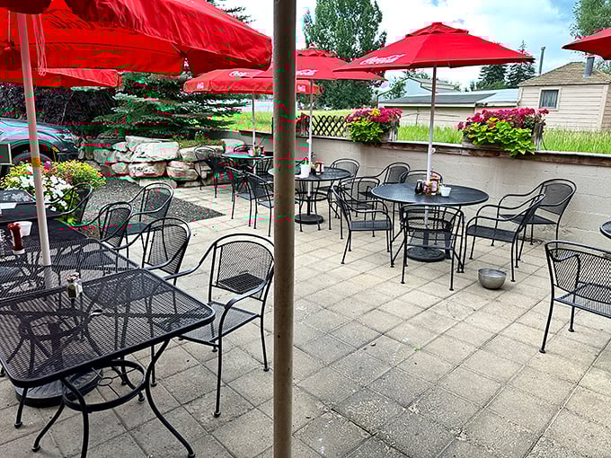 Red umbrellas dot the outdoor patio where summer meals taste even better with a side of fresh mountain air.