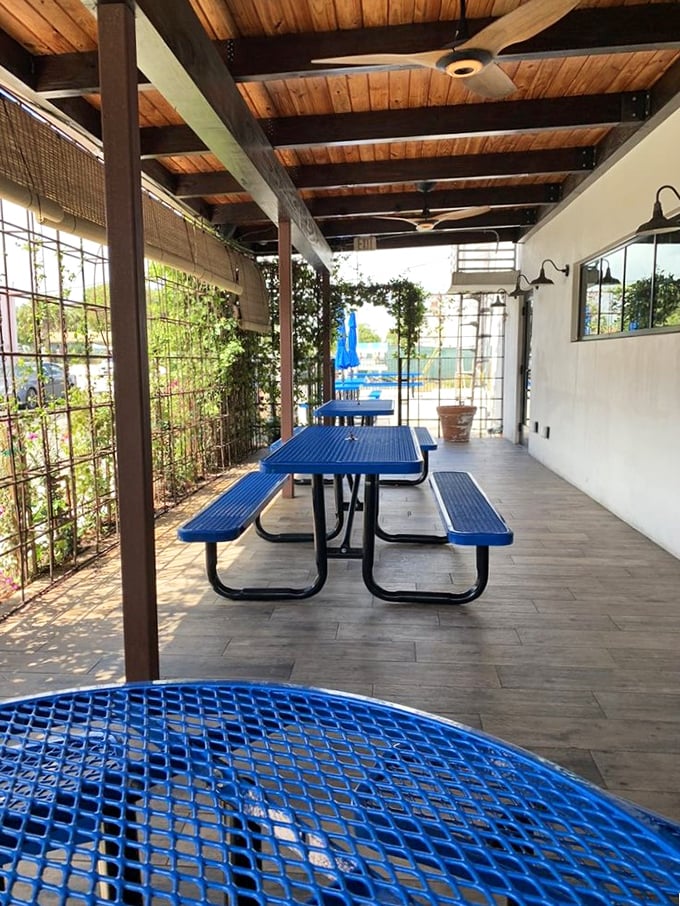 The outdoor seating area offers a breezy Florida respite—because sometimes you need fresh air to contemplate how good that brisket was.