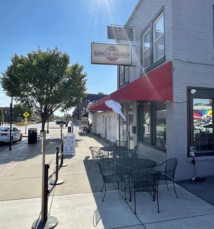 Even the outdoor seating says "no fuss, just flavor" – a sidewalk spot perfect for watching Speedway life roll by between bites of brisket.