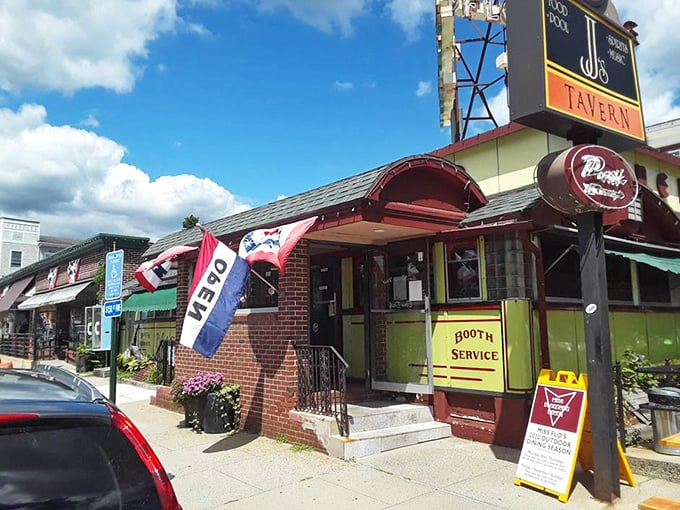 The welcoming entrance with its "OPEN" flag fluttering in the breeze – a simple invitation to one of Massachusetts' most cherished culinary institutions.