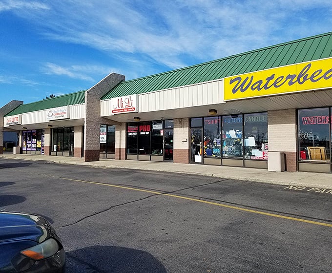 The full exterior view shows Mi Li's place in this Columbus strip mall. Like finding a rare book in a familiar library—unassuming but extraordinary.