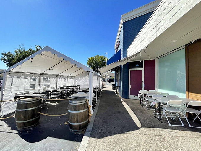 Outdoor seating with rustic wine barrels adds a touch of California wine country charm to your seafood feast under the San Jose sun.
