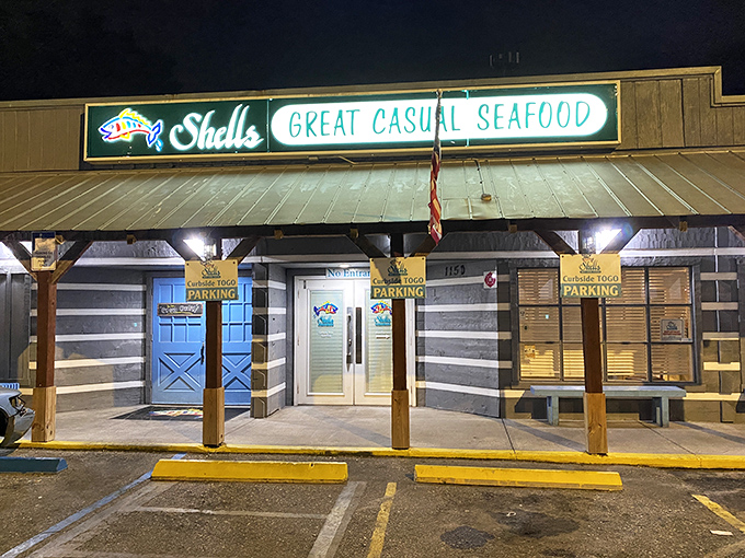 As night falls, the illuminated storefront becomes a lighthouse for hungry travelers navigating the seas of suburban dining options.