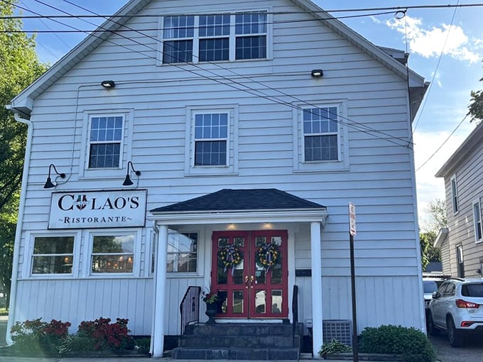 The white clapboard building stands proudly under blue skies, a neighborhood gem that locals treasure and visitors stumble upon with delight.