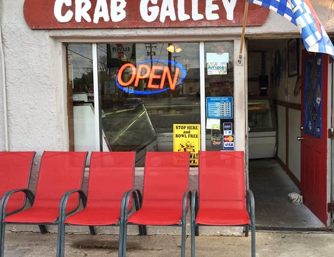 The red chairs outside aren't just seating—they're front-row tickets to the best seafood show in Odenton. No reservations required.