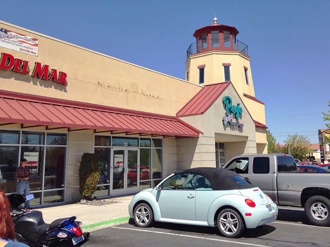 The lighthouse beckons from the strip mall—proof that extraordinary culinary experiences often hide in ordinary locations.