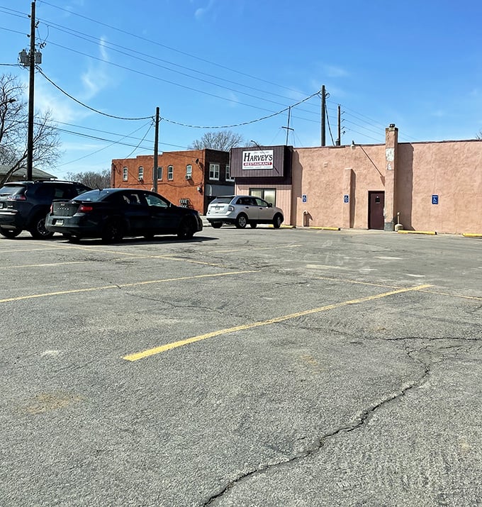The parking lot tells its own story—local license plates, well-worn spaces, and a building that's witnessed decades of first dates, family celebrations, and everyday hunger.