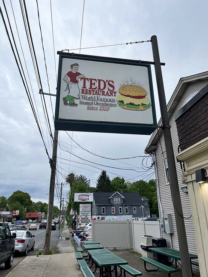 Even on cloudy days, Ted's sign shines like a beacon for burger pilgrims seeking steamed cheeseburger enlightenment.