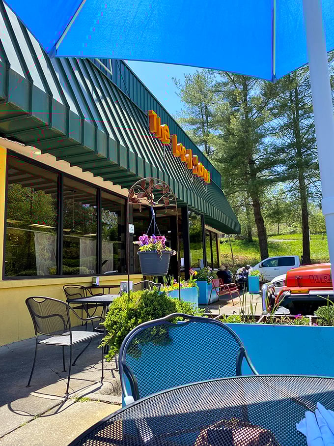 Colorful umbrellas provide shade while you contemplate ordering seconds—a decision that practically makes itself at The Local Joint.