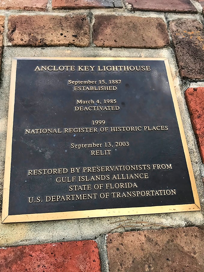 History cast in bronze. This plaque tells the lighthouse's story from 1887 establishment to its 2003 relighting – a beacon of preservation.