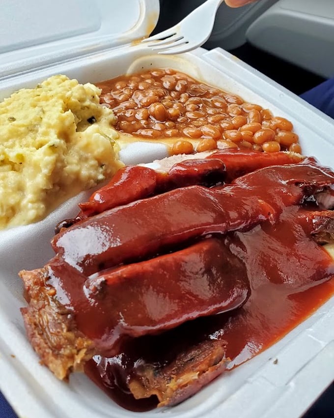 Saucy ribs with potato salad and beans—the holy trinity of barbecue that justifies every mile of your journey to Homewood.