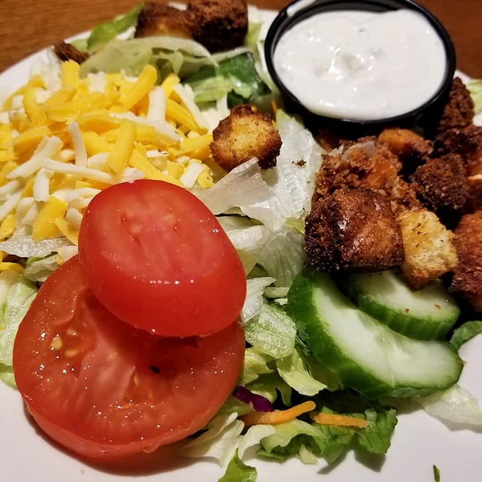 Even the salads get special treatment here – fresh vegetables, shredded cheese, and house-made croutons prove that sides aren't an afterthought at this barbecue haven.