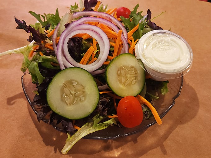 A garden salad that proves vegetables can hold their own at a seafood feast—crisp, colorful, and ready for its supporting role.