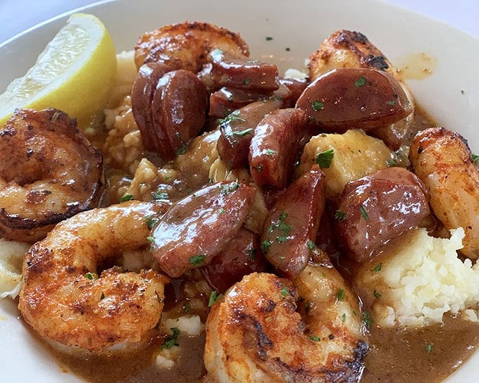 Shrimp and grits with sausage—the culinary equivalent of a warm Southern hug that somehow tastes even better than it looks.