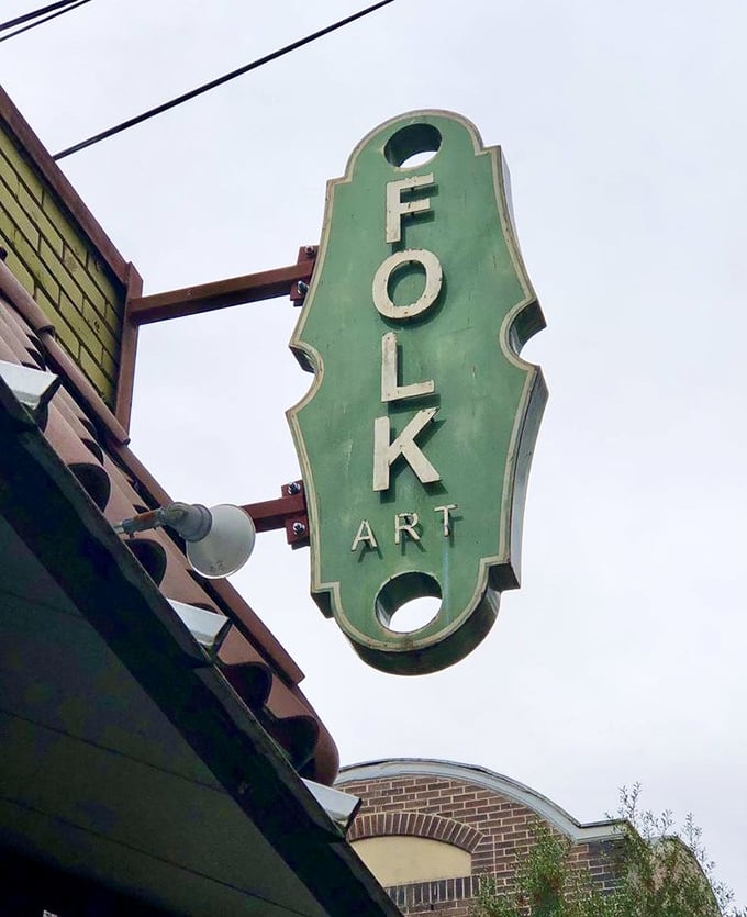 The vertical Folk Art sign doesn't just mark a restaurant—it signals you've arrived at a place where breakfast dreams come true and calories don't count.