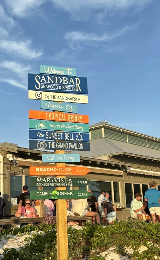 The sign says it all: tropical drinks, toes-in-the-sand dining, and sunset celebrations. This isn't just a restaurant—it's Florida's greatest hits album.