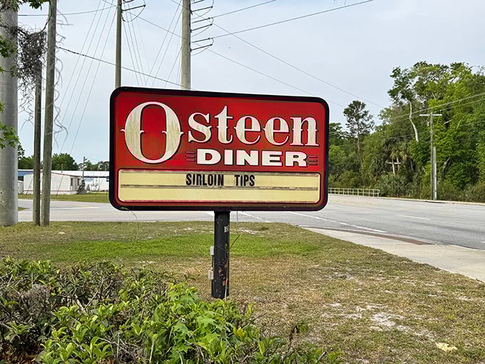 The roadside sign stands as a beacon of hope for hungry travelers—a promise of sirloin tips and other delights just waiting to be discovered.