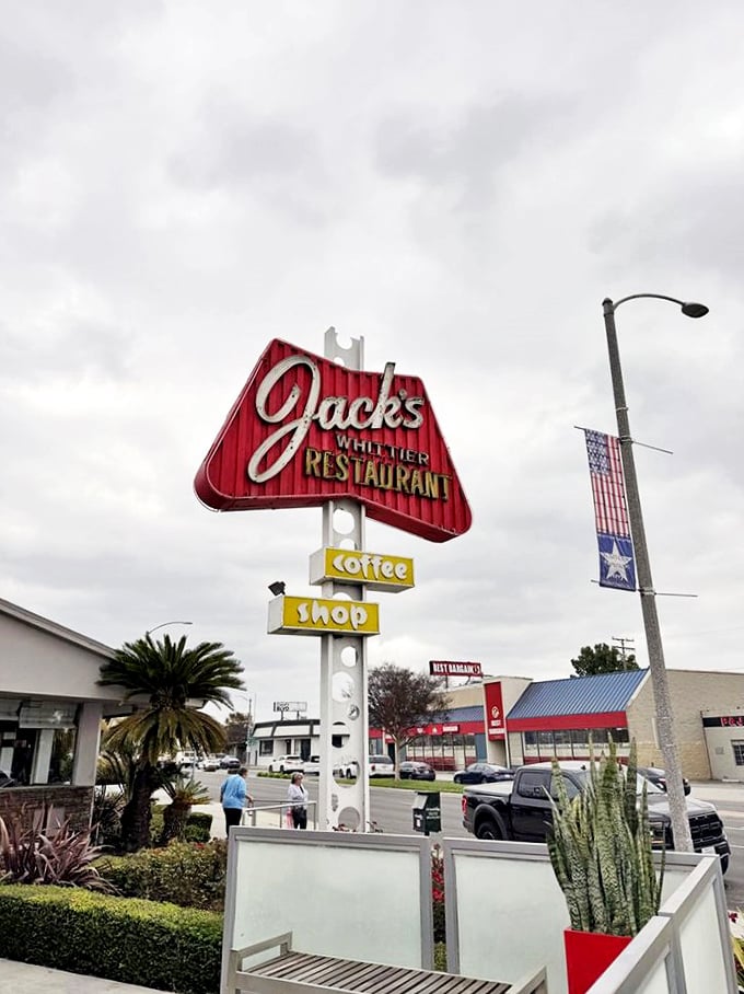 Even on cloudy days, that red arrow sign points the way to comfort food paradise—follow it like the North Star of nourishment.