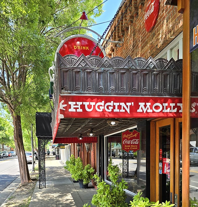 That distinctive ornate metalwork and bold red signage doesn't just mark a restaurant—it announces a beloved Abbeville institution.