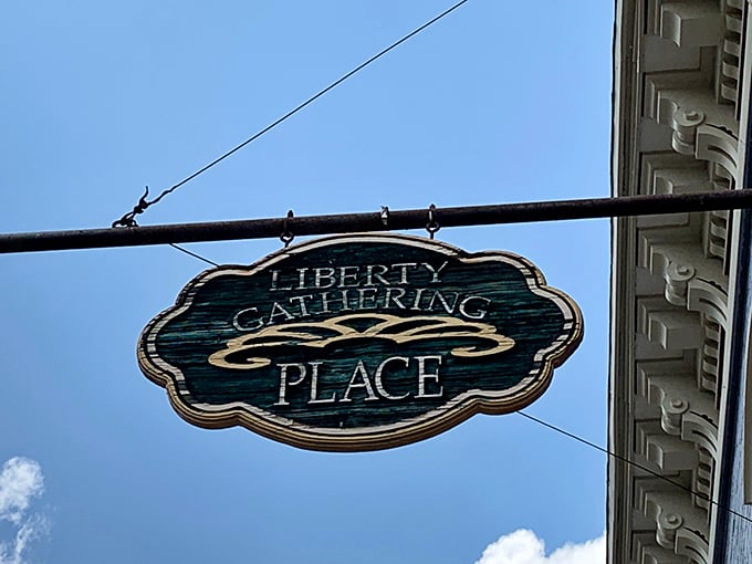 The hanging sign gently swaying above downtown West Liberty—a beacon for hungry travelers and a landmark for locals coming home.