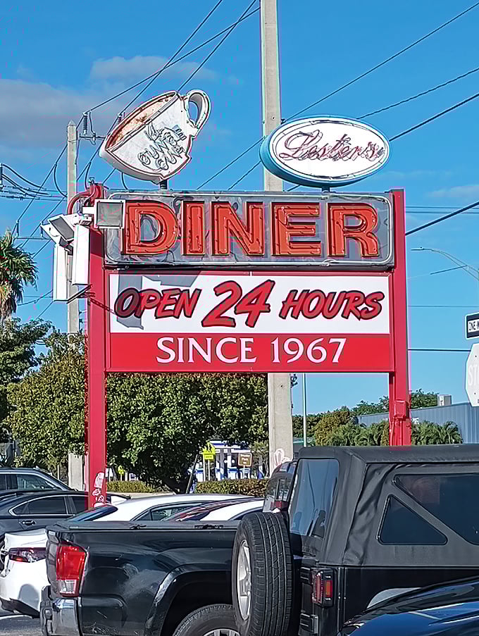 The neon sign promises "Open 24 Hours"—because hunger doesn't check its watch before making demands.