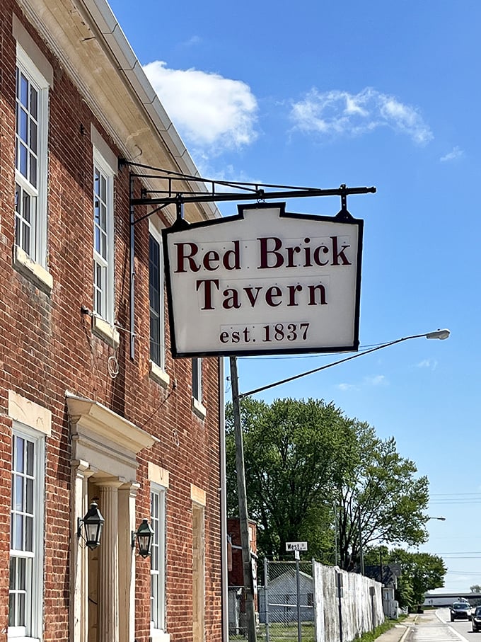 That iconic sign swinging gently in the Ohio breeze – a beacon for hungry travelers since Andrew Jackson's presidency, still drawing them in today.