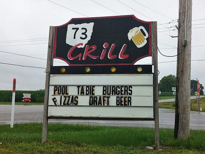 The roadside sign tells you everything you need to know: burgers, pizza, pool, and beer. The four food groups of happiness, Ohio-style.