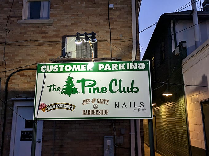 The parking sign promises more than just a place for your car – it's the first step on your journey to steak nirvana.