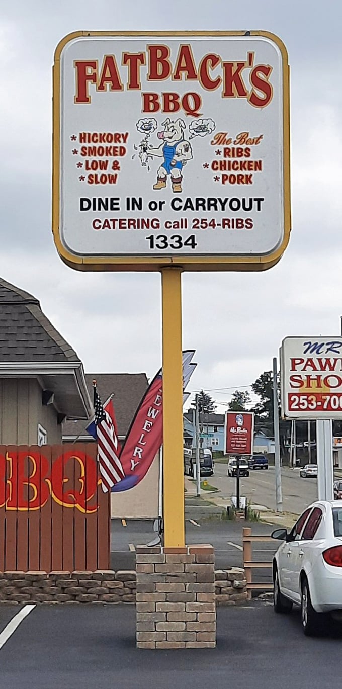 The roadside sign that's saved countless hungry travelers—a beacon of BBQ hope on Linden Avenue that simply says, "Salvation this way."