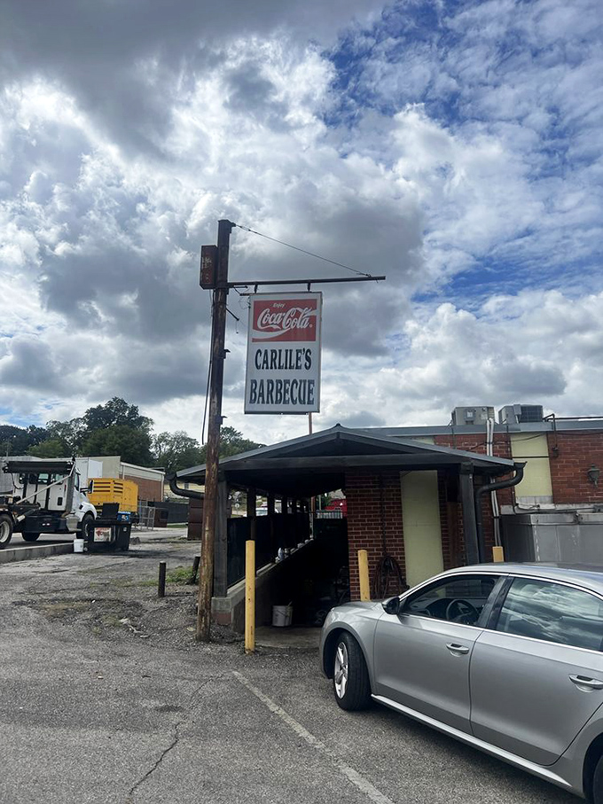That vintage Coca-Cola sign has been directing hungry travelers to Carlile's for decades—a beacon of barbecue hope on the Birmingham horizon.