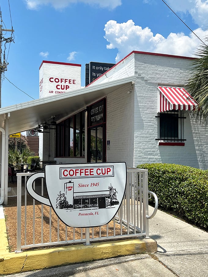 The cup-shaped sign says it all—this isn't just a restaurant name, it's a promise of what awaits inside those white brick walls.