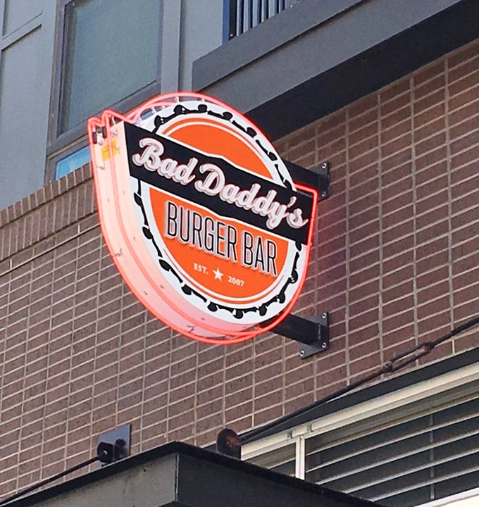 That circular neon sign doesn't just mark a restaurant—it's a beacon of hope for the burger-deprived souls of suburban Atlanta.