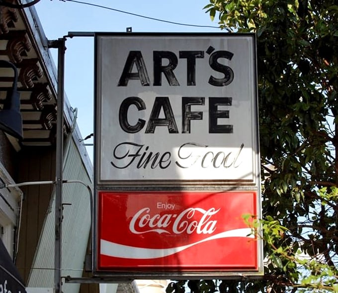 A sign that promises exactly what it delivers: "Fine Food" without fanfare or fuss. In a world of hype, Art's Cafe keeps it refreshingly real.
