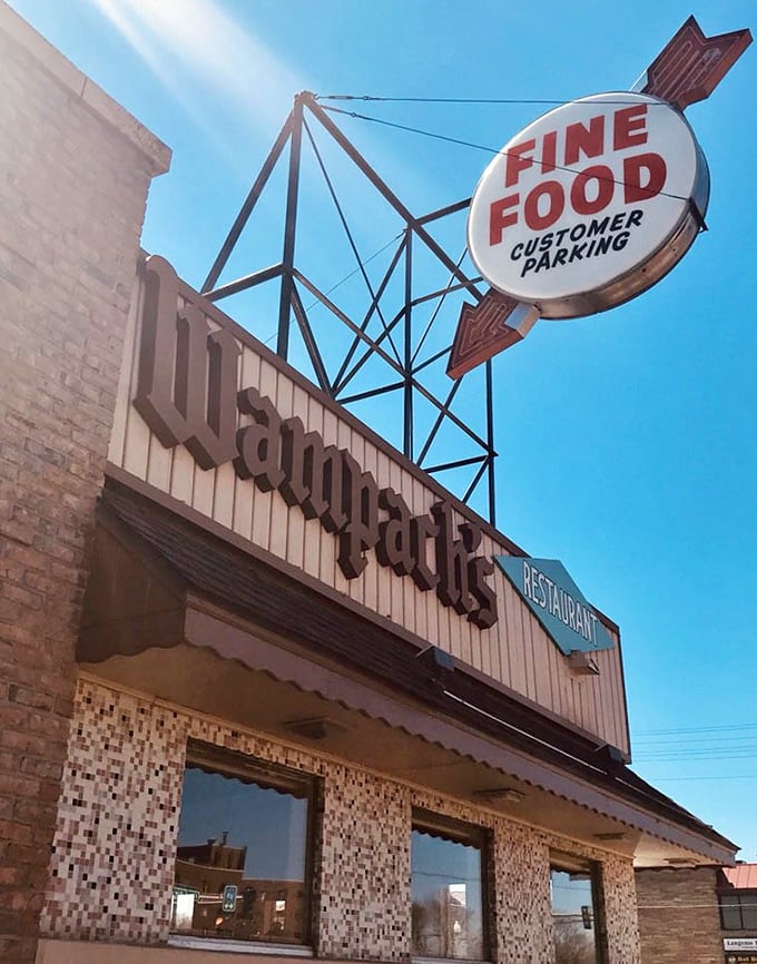 That arrow-shaped sign doesn't just point to the entrance—it directs you toward one of Minnesota's most authentic dining experiences, no GPS required.