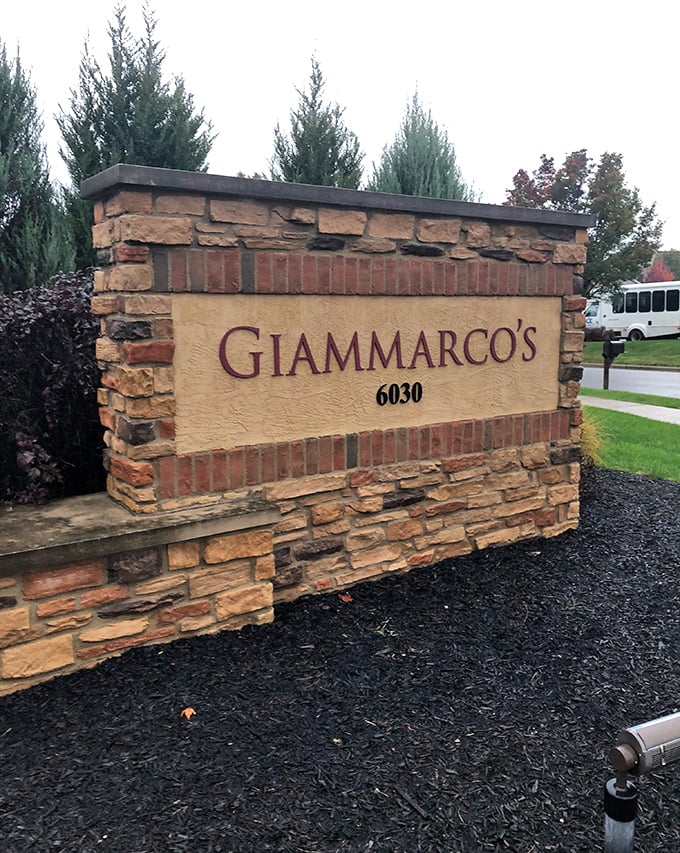 The stone entrance sign stands as a landmark of promised culinary pleasure – like a delicious X marking the spot on your gastronomic treasure map.