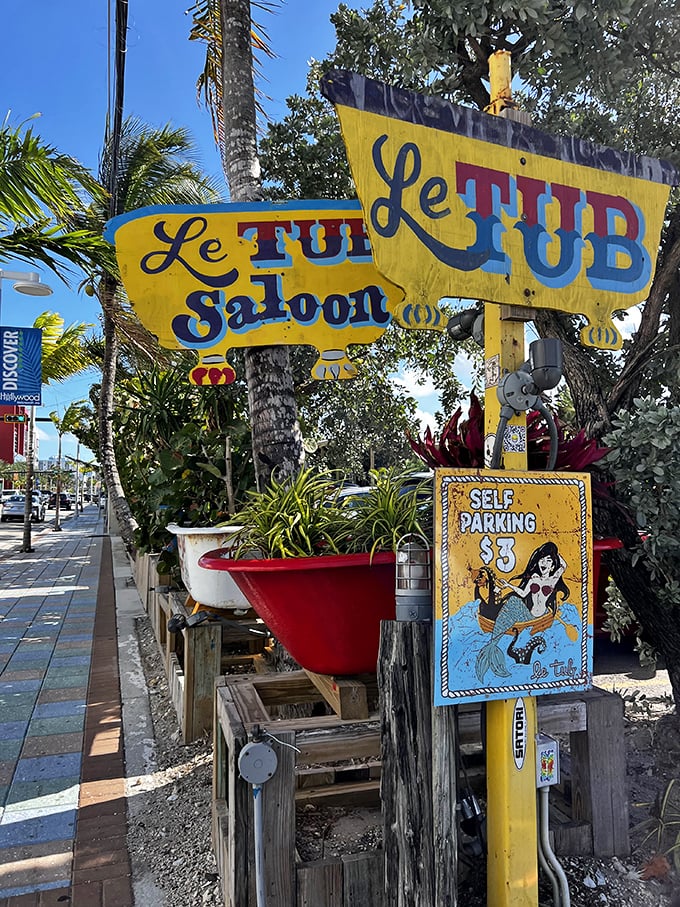 The "Le Tub Saloon" sign, complete with bathtubs as planters, is your final warning: abandon all pretension, ye who enter here.