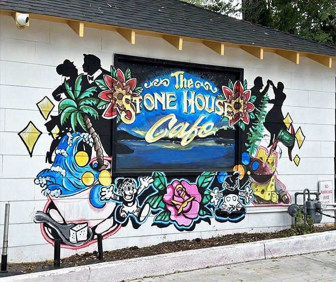 The vibrant mural announces you've found the right place – a colorful preview of the creative energy waiting inside Stone House Café.