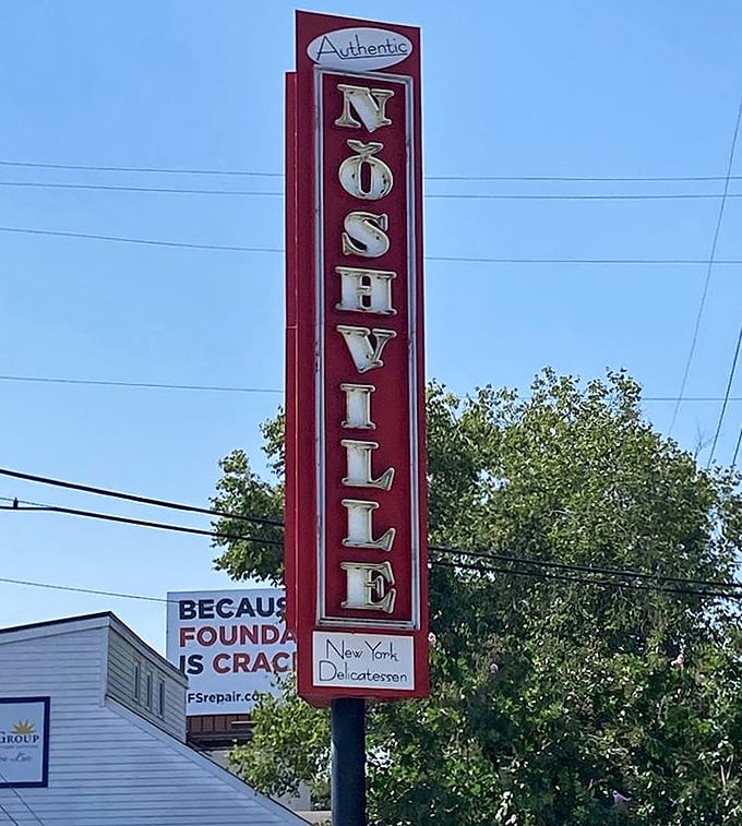 This sign stands tall like a delicious promise. It's not just pointing to a restaurant—it's directing you toward your next great meal.