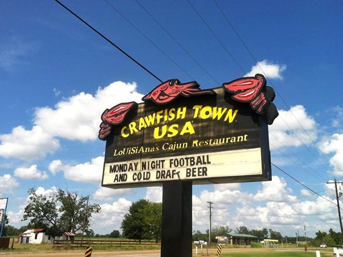 The roadside sign promises Monday Night Football and cold draft beer—because in Louisiana, good food is just the beginning of hospitality.