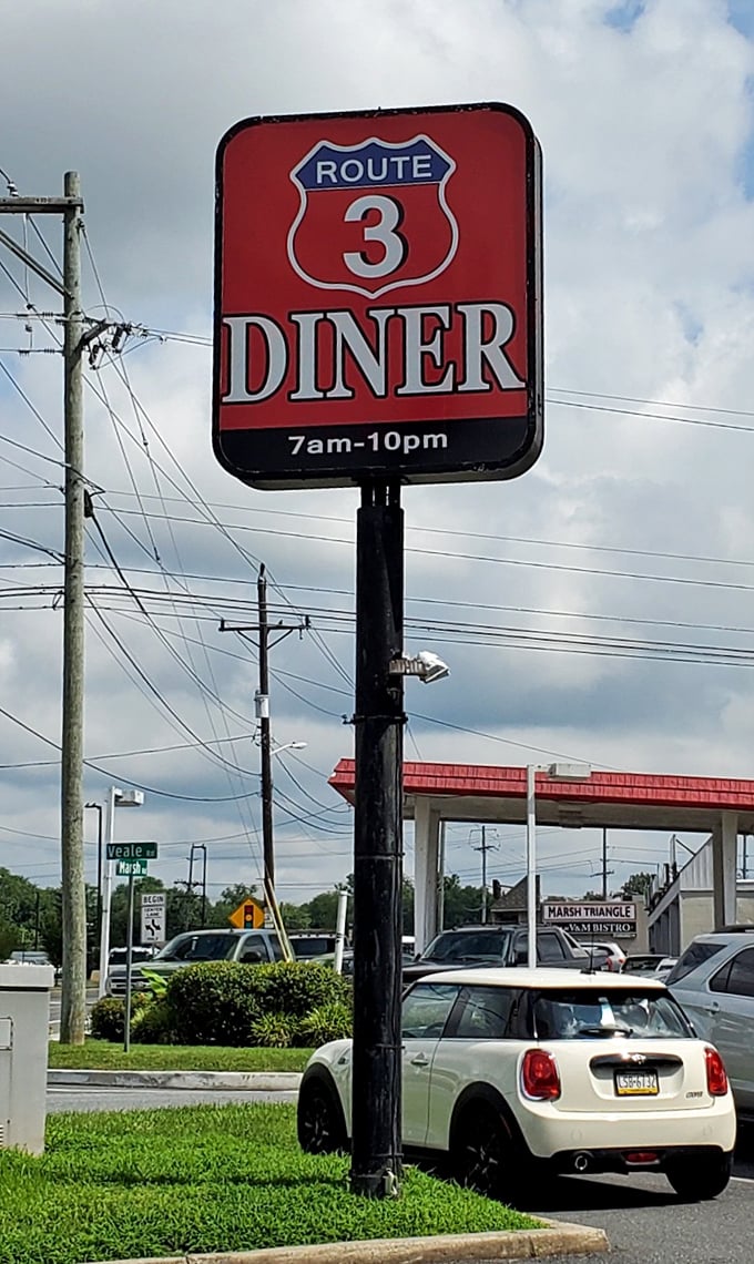 The iconic Route 3 Diner sign stands tall – a red beacon of hope for hungry travelers and a landmark for locals giving directions.