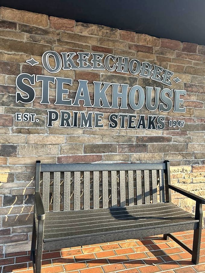 "EST. 1947" isn't just a date—it's a promise of tradition. That bench isn't for waiting; it's for sitting in reverent appreciation after your meal.