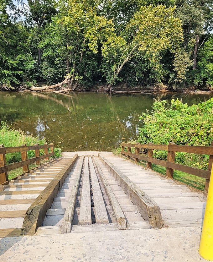 The river access ramp—where adventures begin, sneakers get wet anyway, and everyone remembers why they left the couch behind.