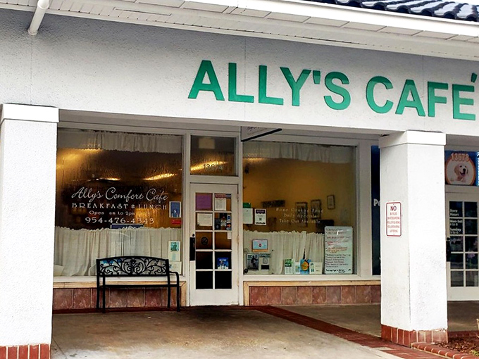 The green Ally's Cafe sign—a beacon of hope for hungry travelers and a landmark for locals who know where real Florida flavor lives.