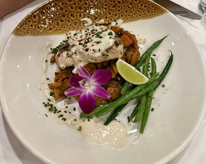 Swordfish elevated to art form, perched atop a colorful medley. The purple orchid isn't just garnish—it's a celebration of Florida's tropical spirit.