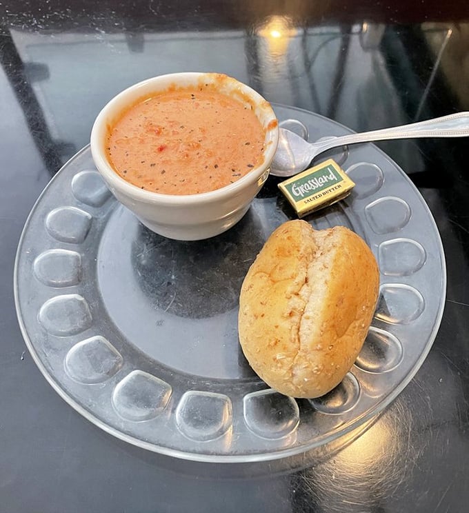 Tomato bisque that understands comfort doesn't need to be complicated—just perfectly seasoned, soul-warming, and ready for that roll to take a dip.