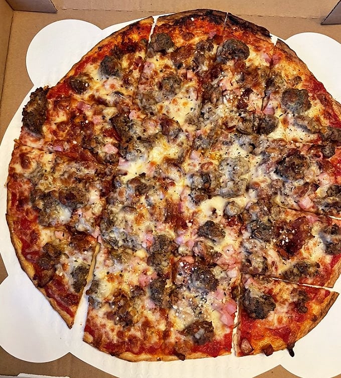 Behold the mighty Turbo Meater – a protein festival where sausage, pepperoni, and ham gather for the most delicious reunion imaginable.