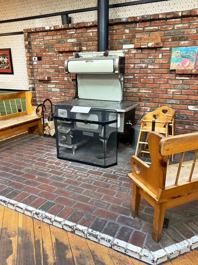 The vintage stove stands like a museum piece against the brick wall – a nod to simpler times when patience produced perfection.