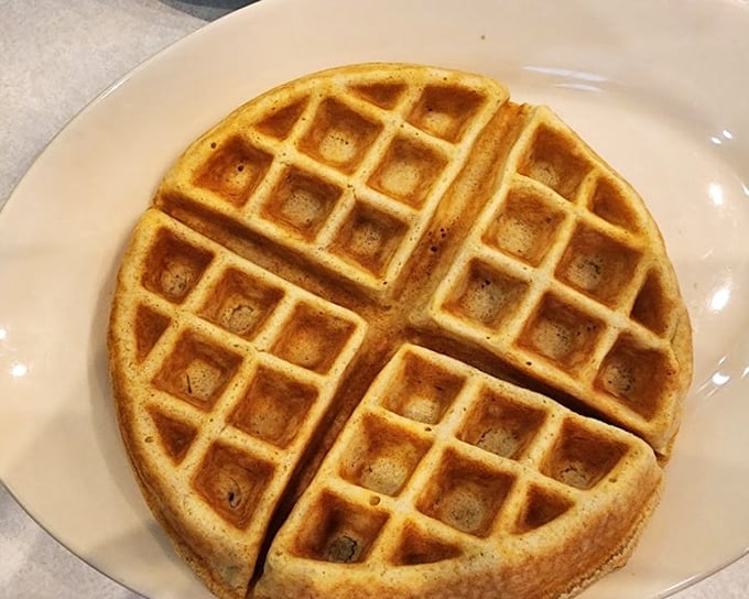 The waffle's perfect grid pattern isn't just for show—it's engineered to hold maximum syrup in those golden pockets of breakfast joy.